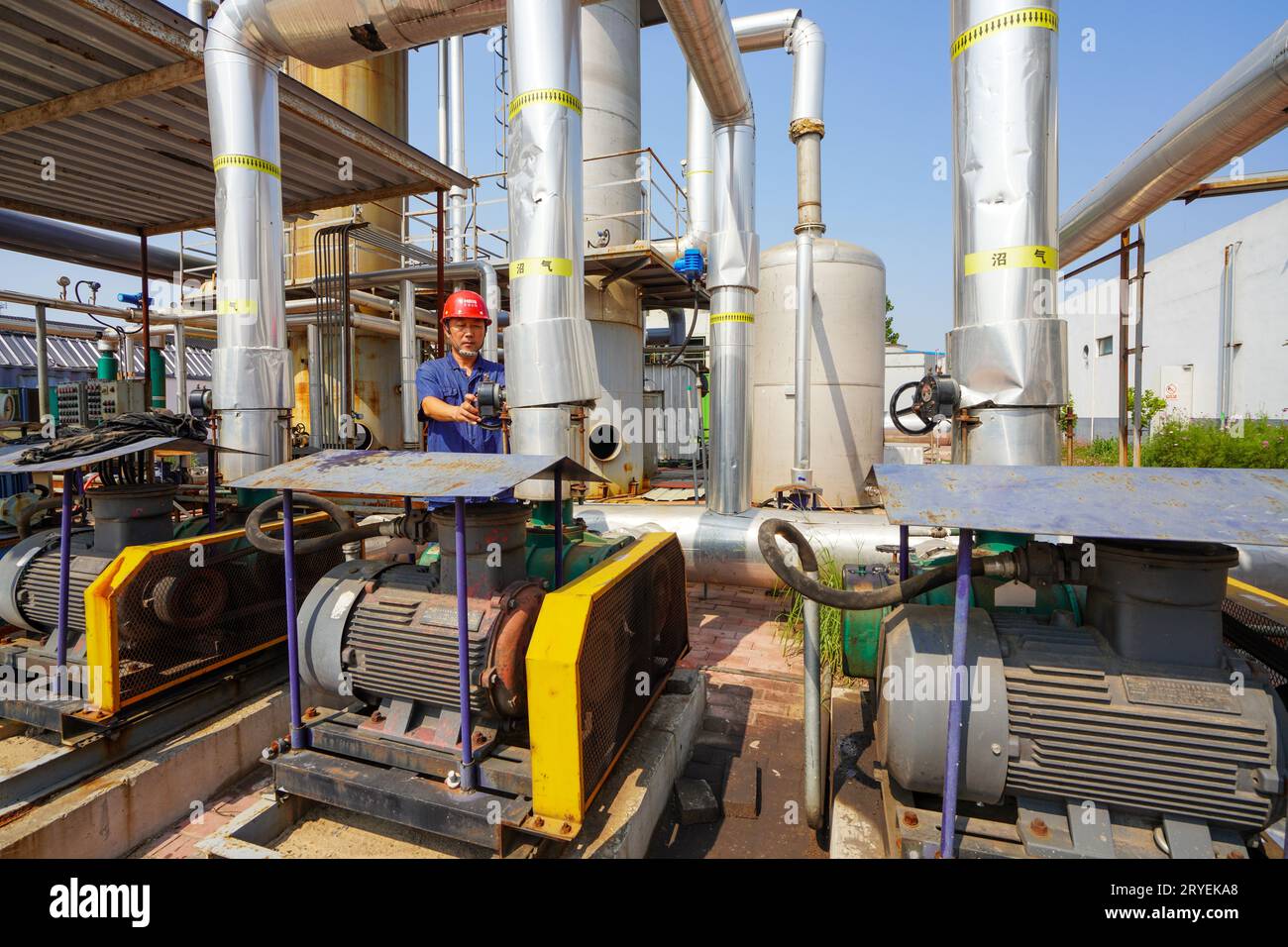 Luannan County, China - July 18, 2023: Workers are adjusting the biogas ...