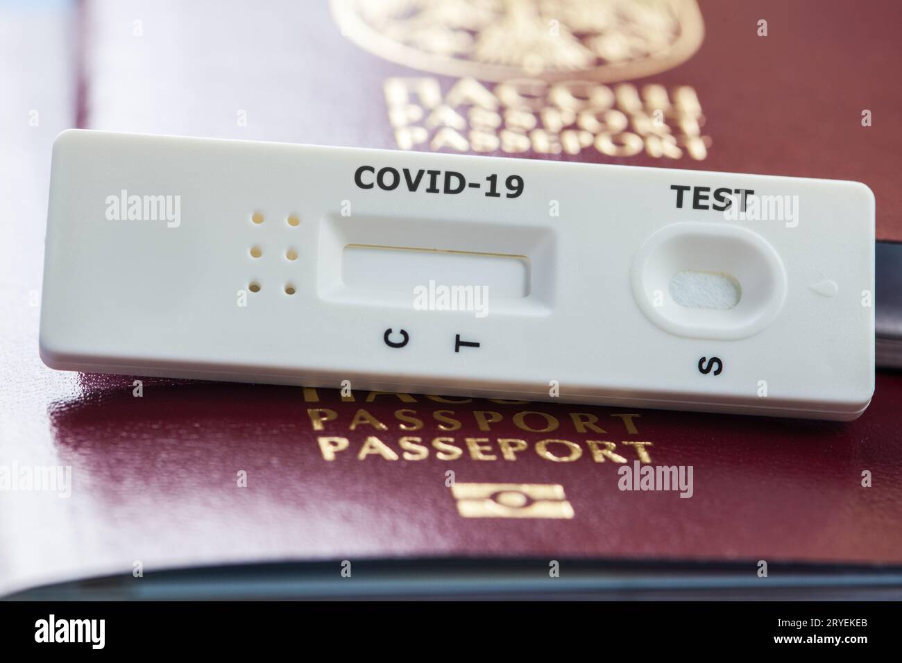 COVID-19 virus disease rapid testing kit on red passport Stock Photo ...