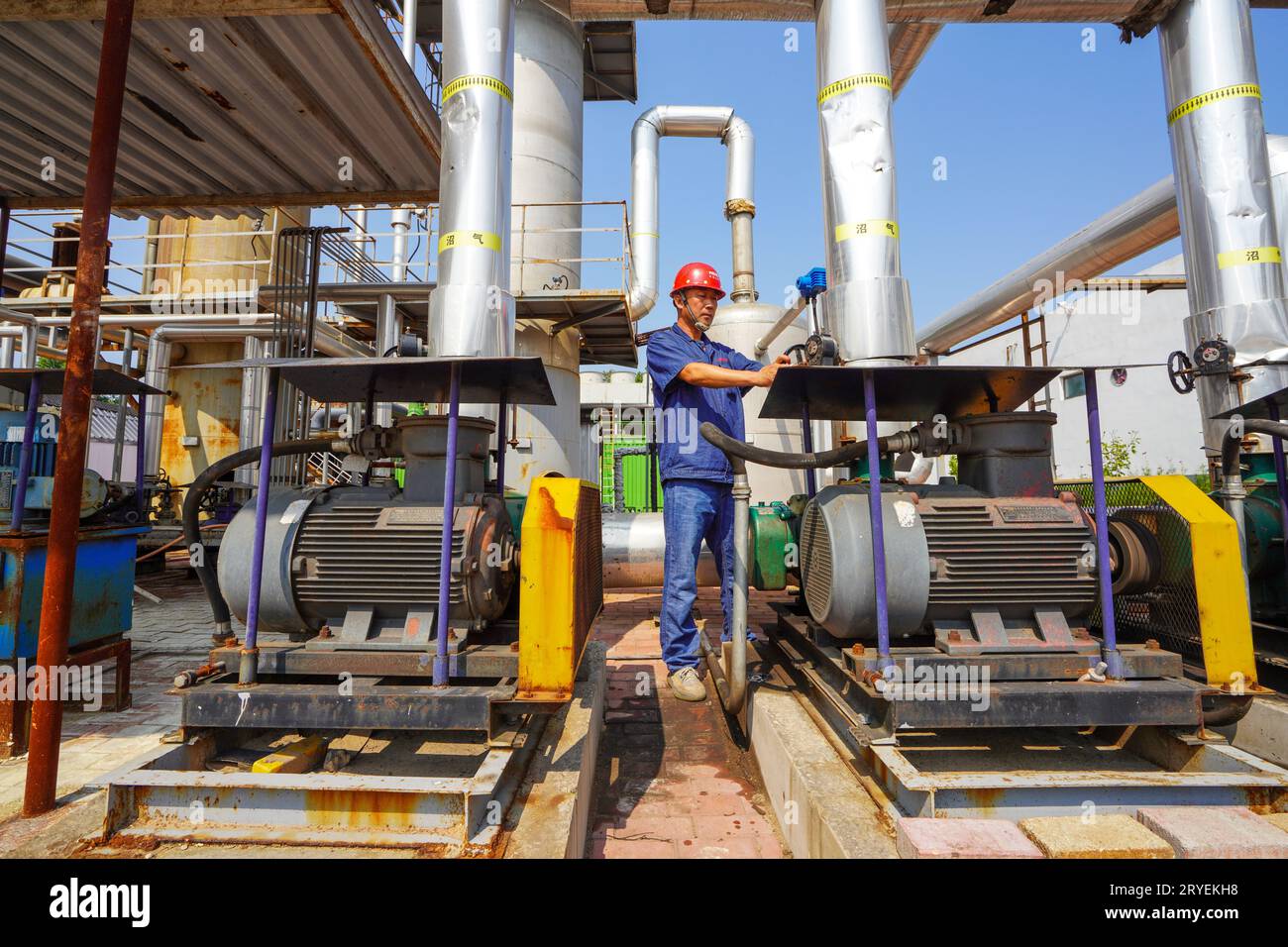 Luannan County, China - July 18, 2023: Workers are adjusting the biogas ...