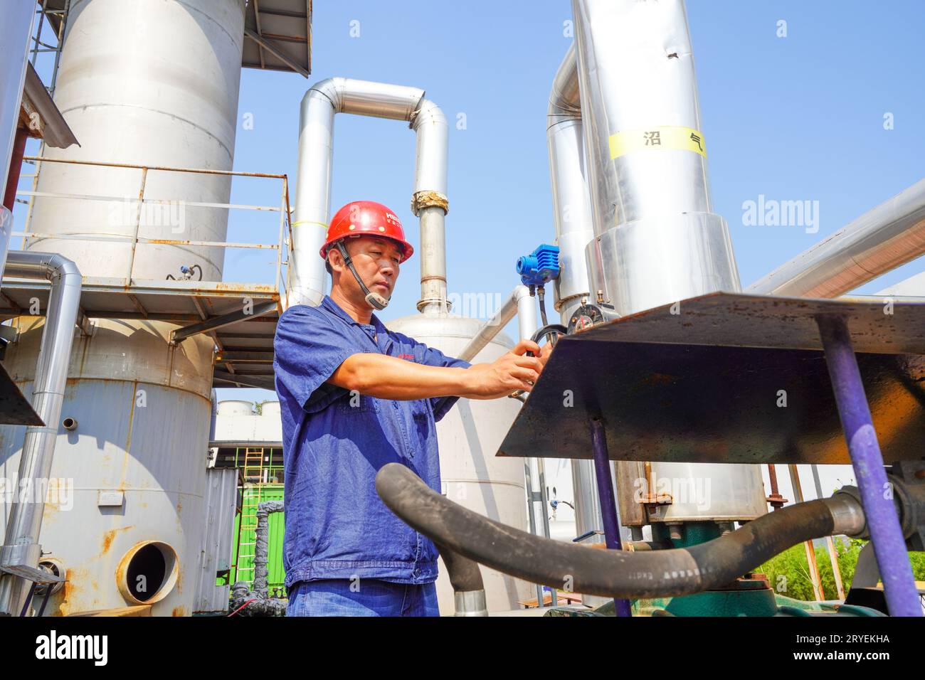 Luannan County, China - July 18, 2023: Workers are adjusting the biogas ...