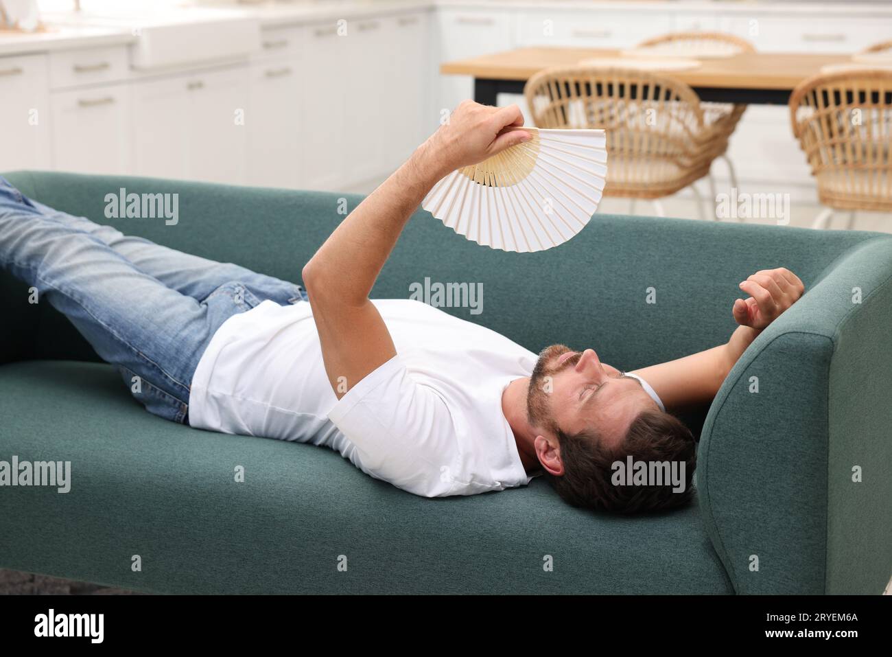 Fanning himself fan hi-res stock photography and images - Alamy