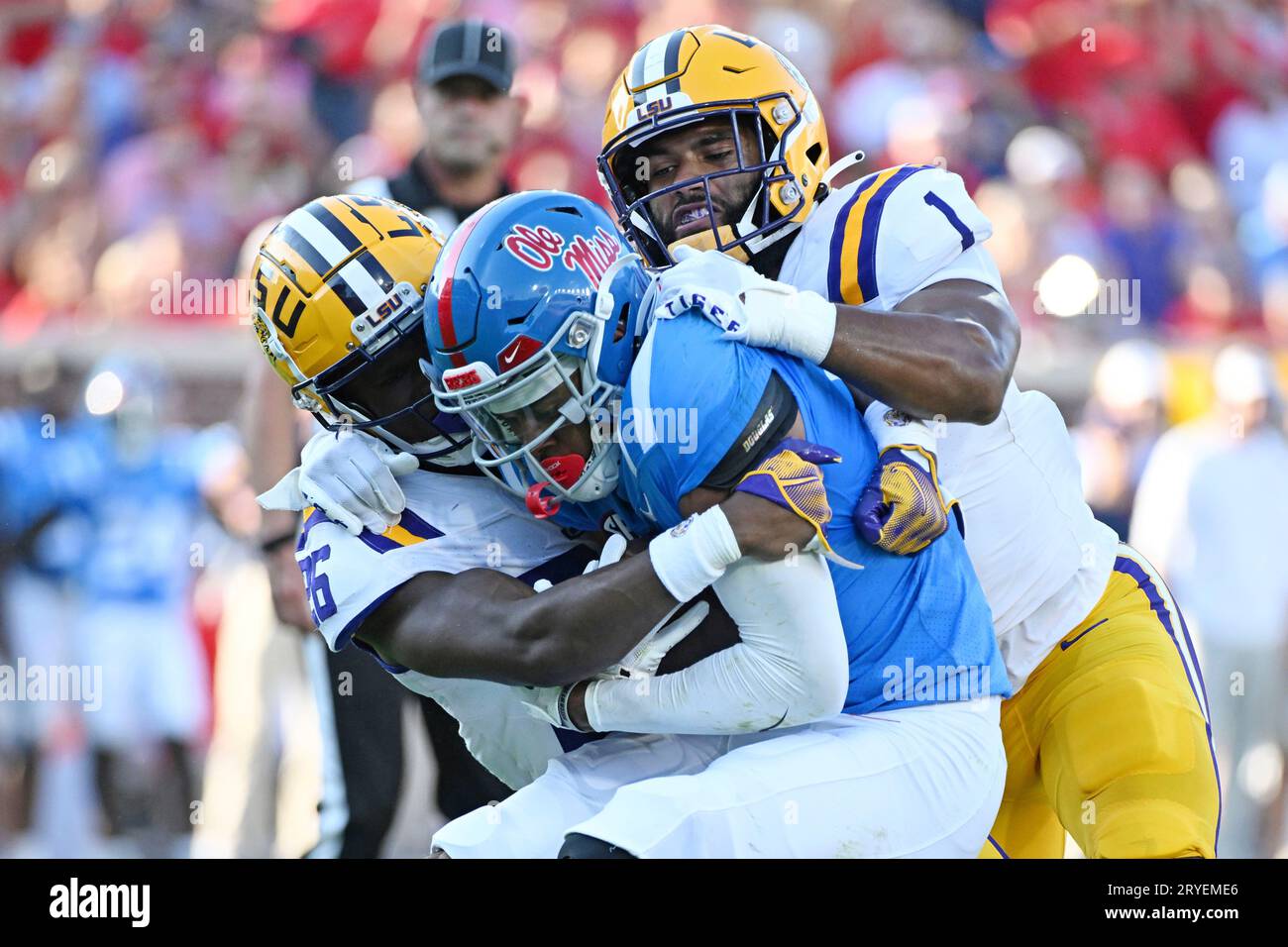 LSU cornerback Ashton Stamps and linebacker Omar Speights (1) tackle Mississippi wide receiver ...