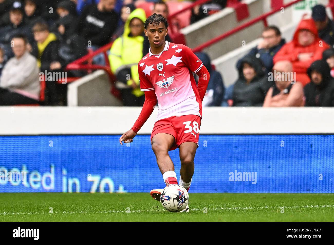 Theo Chapman #38 of Barnsley passes the ball during the Sky Bet League ...