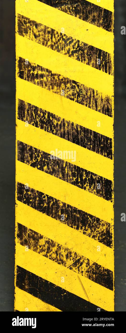 Yellow background with black grunge hazard sign Stock Photo - Alamy