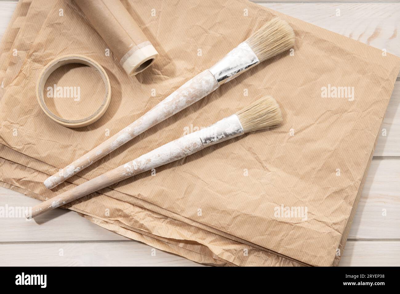 Set of painting tools brushes, masking tape, paper Stock Photo - Alamy
