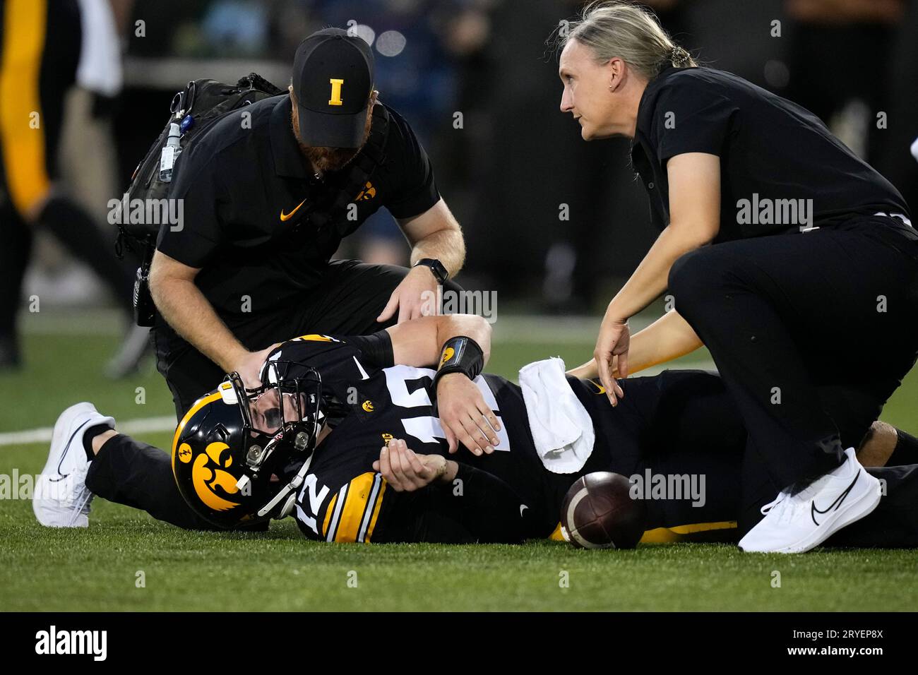 Iowa quarterback Cade McNamara (12) lies injured on the field during ...