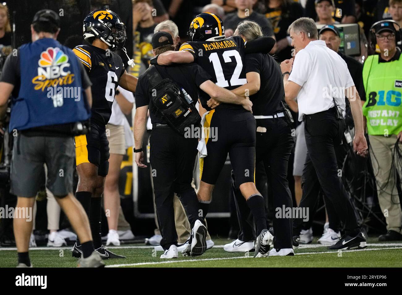 Iowa quarterback Cade McNamara (12) is helped off the field after ...