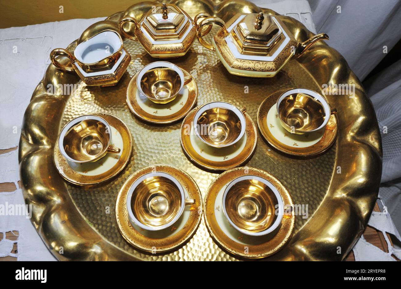 Serving a golden coffee set Stock Photo - Alamy