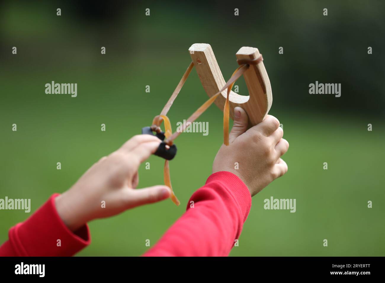 Little boy playing with slingshot outdoors, closeup Stock Photo - Alamy