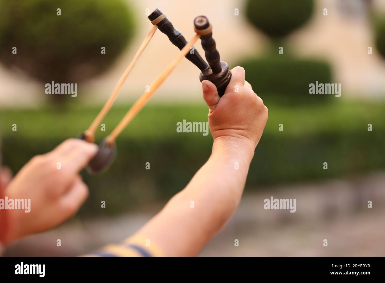 Little boy playing with slingshot outdoors, closeup Stock Photo - Alamy