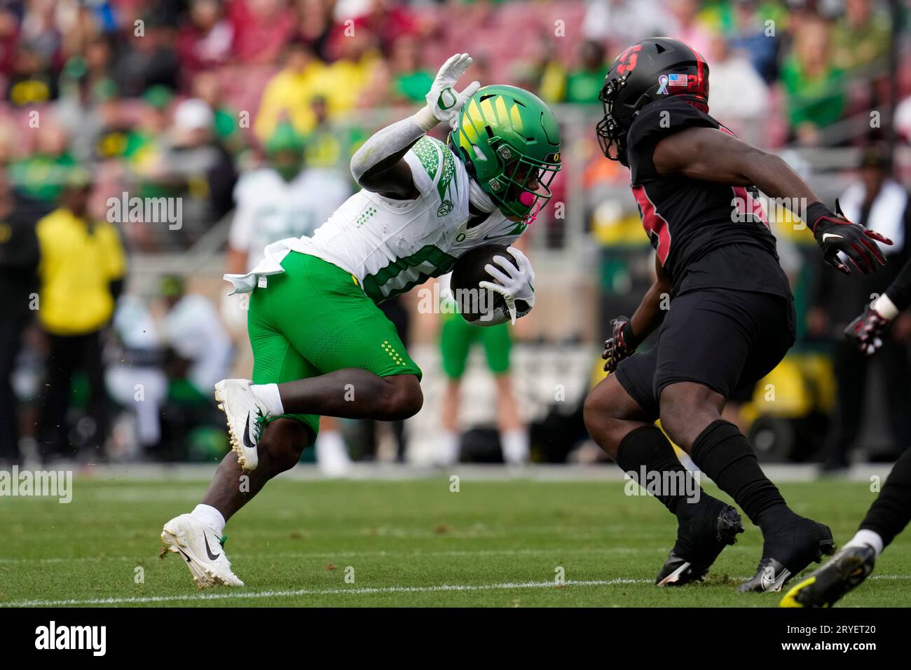 Oregon running back Bucky Irving, left, runs the ball against Stanford ...