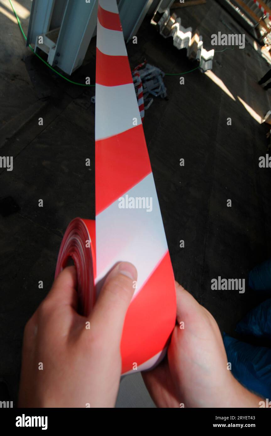 Red and white striped barrier tape Stock Photo - Alamy