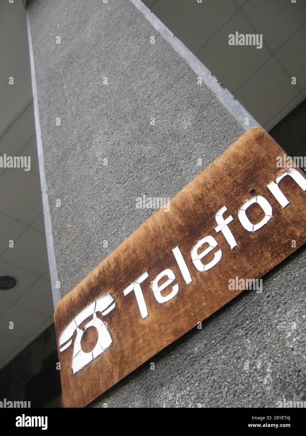 Landline telephone symbol, white, brown background Stock Photo - Alamy