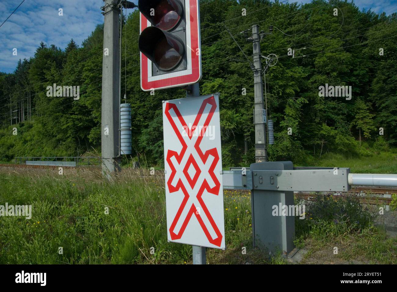 Railway crossing, level crossing sign Stock Photo - Alamy