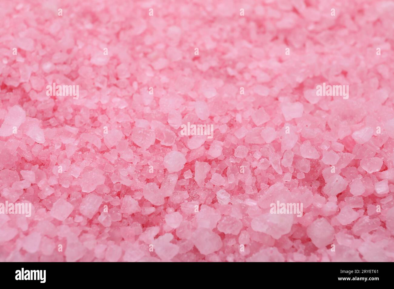 Pink sea salt as background, closeup view Stock Photo - Alamy