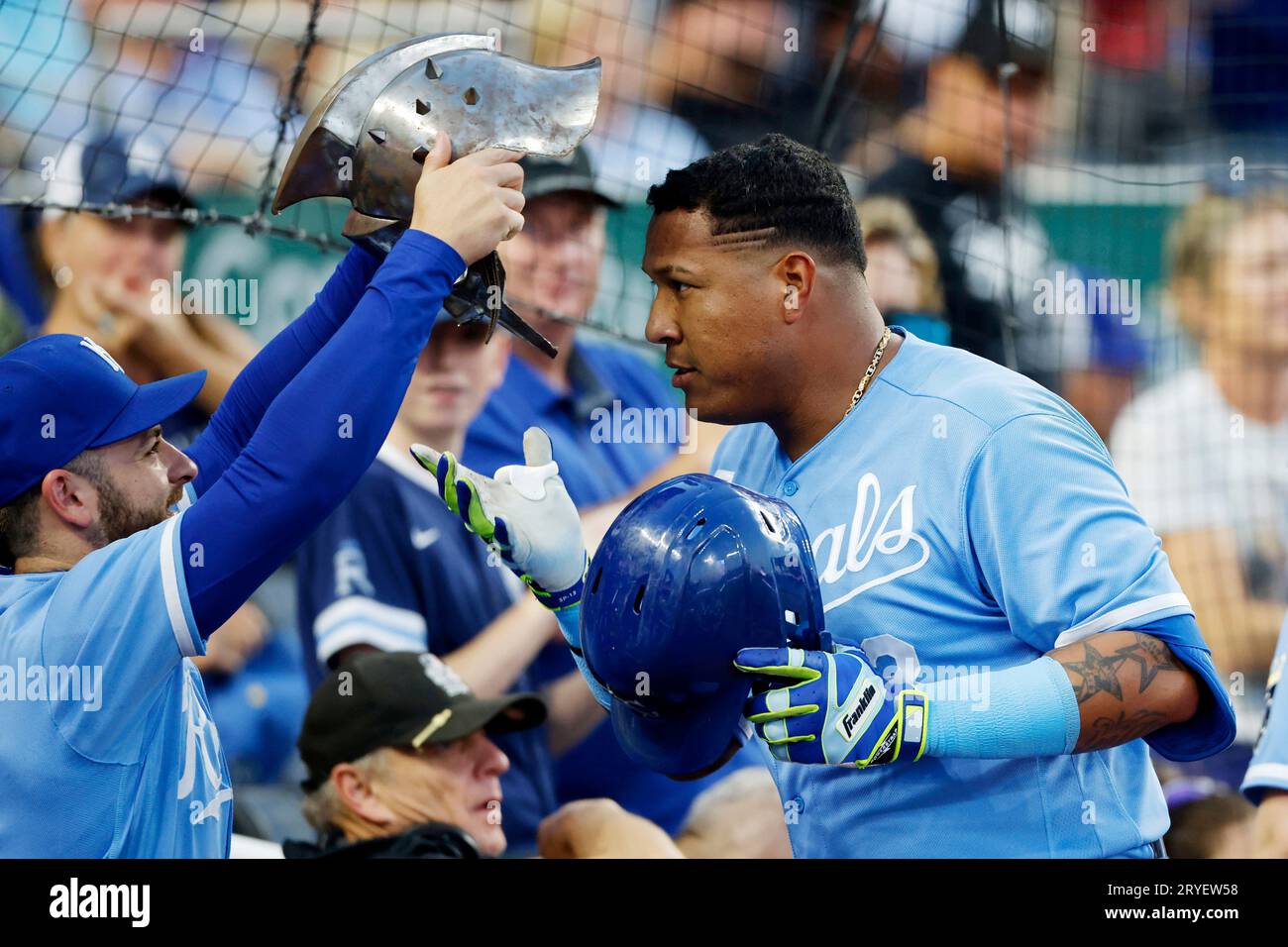 Kansas City Royals' Kyle Isbel, left, gives Salvador Perez, right, the ...