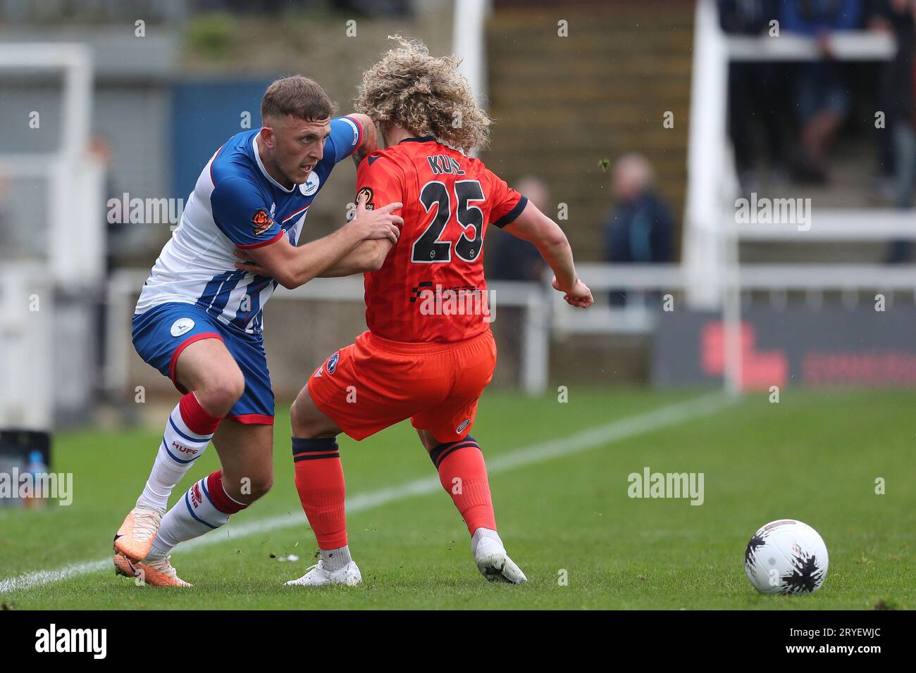 Oliver Finney of Hartlepool United battles with Aaron Kuhl of Dorking ...