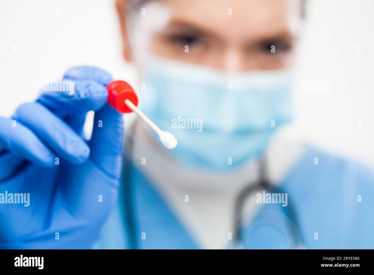 Female caucasian UK NHS GP doctor holding swab collection stick Stock ...