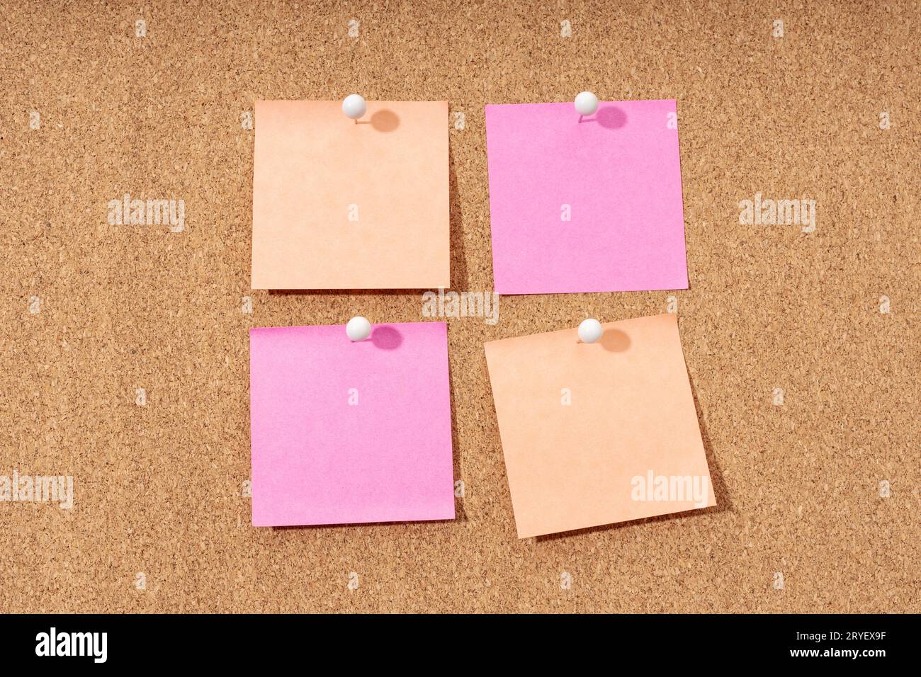 Group of four Blank note on a cork board for adding text and push pin ...