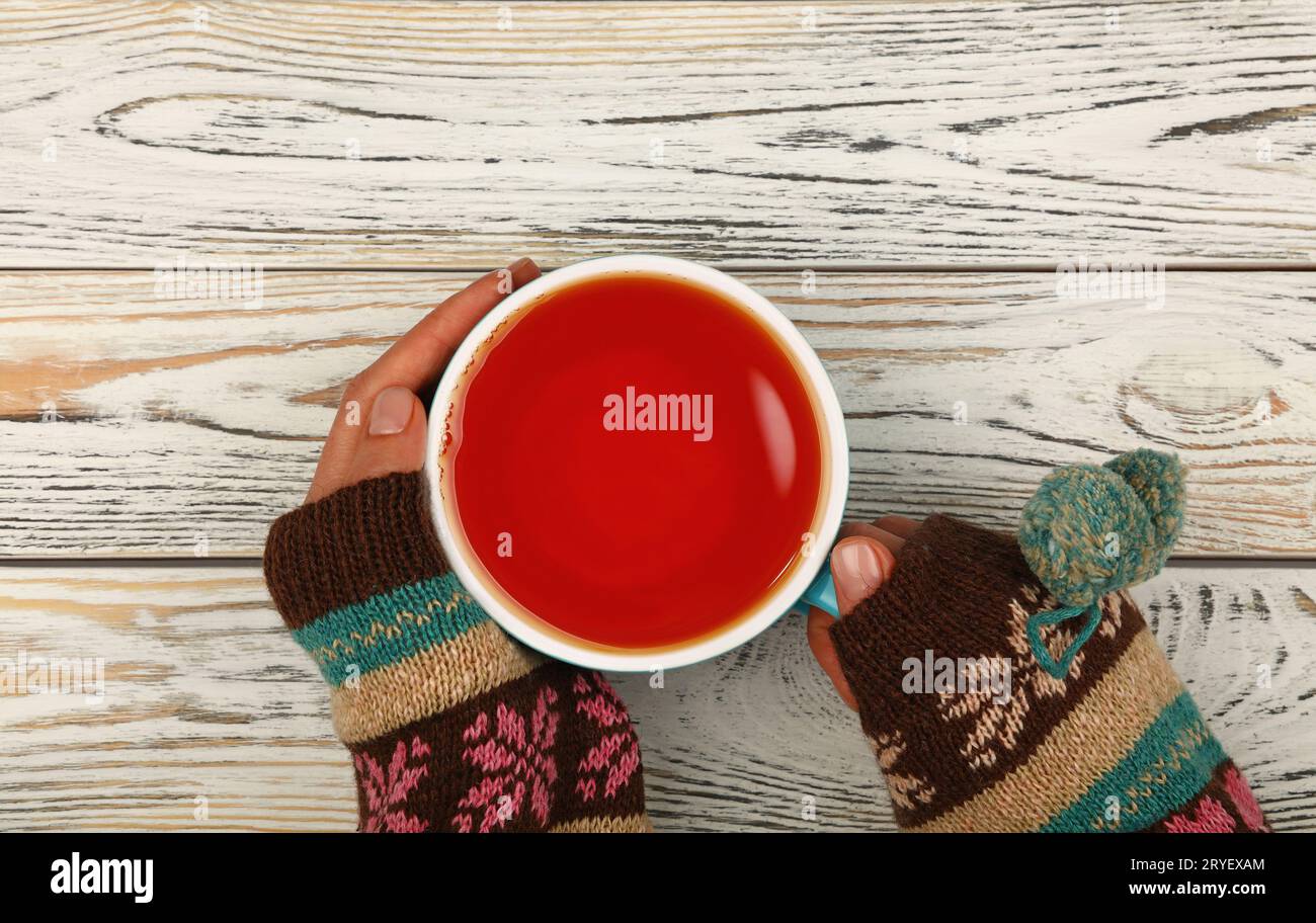 Woman hands hold full cup of black tea Stock Photo - Alamy