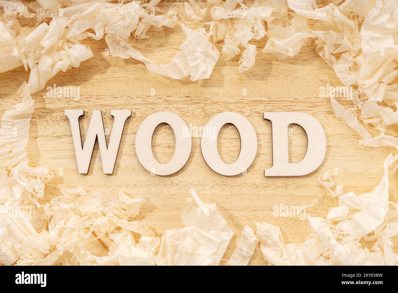 Wooden word or wood table and wood shavings Stock Photo - Alamy