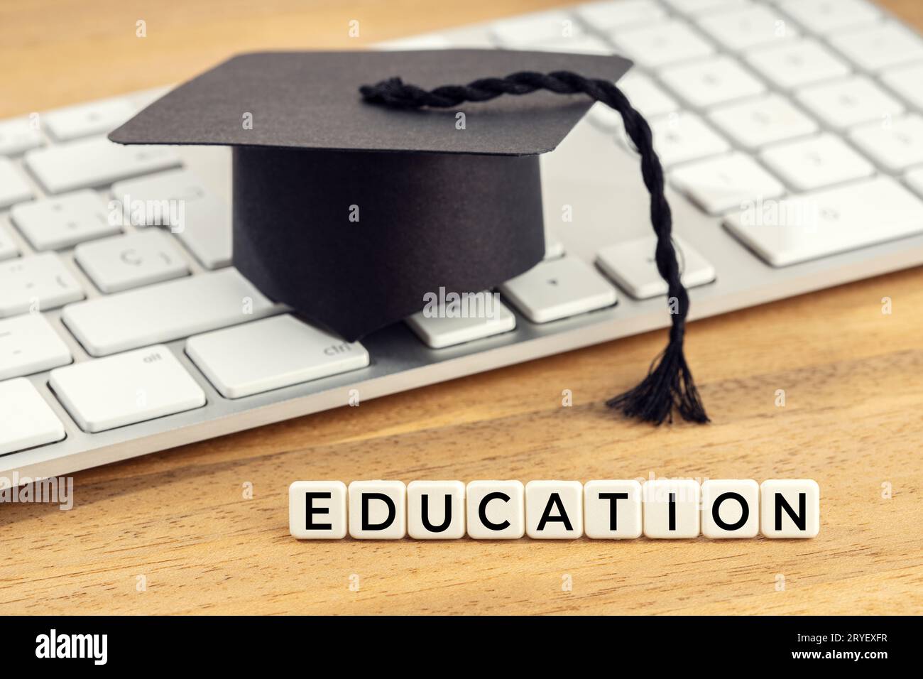 Education concept. Graduation cap on computer keyboard Stock Photo - Alamy