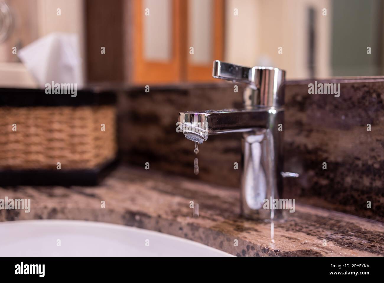 Water running from a toilet sink tap Stock Photo - Alamy