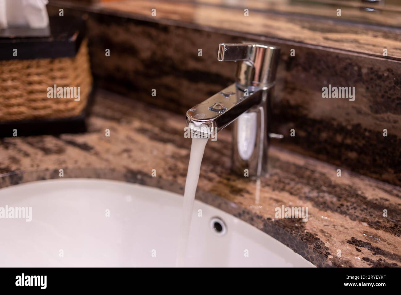 Water running from a toilet sink tap Stock Photo - Alamy