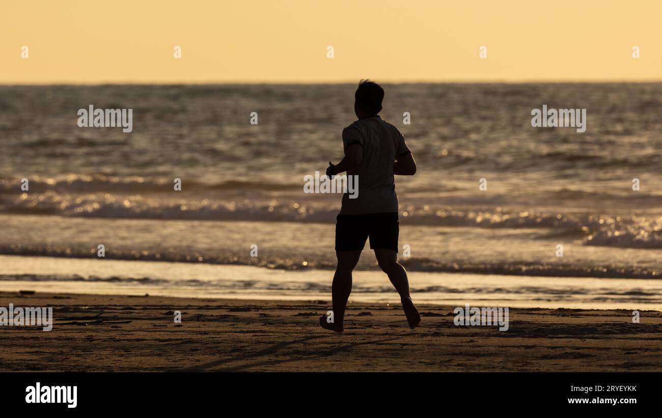 Man jogging on beach during hi-res stock photography and images - Alamy