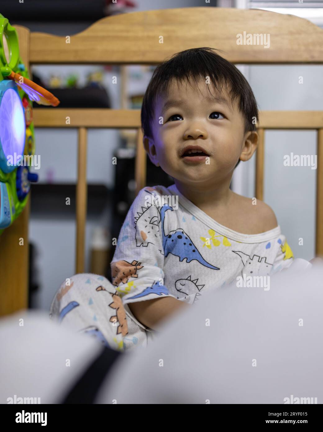 Portrait image of 1-2 years old childhood child. Face of relax and happy Asian boy in head shot ...