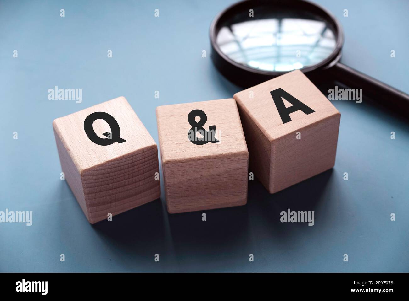 Q&A or questions and answers concept. Wooden cube written with letter Q ...