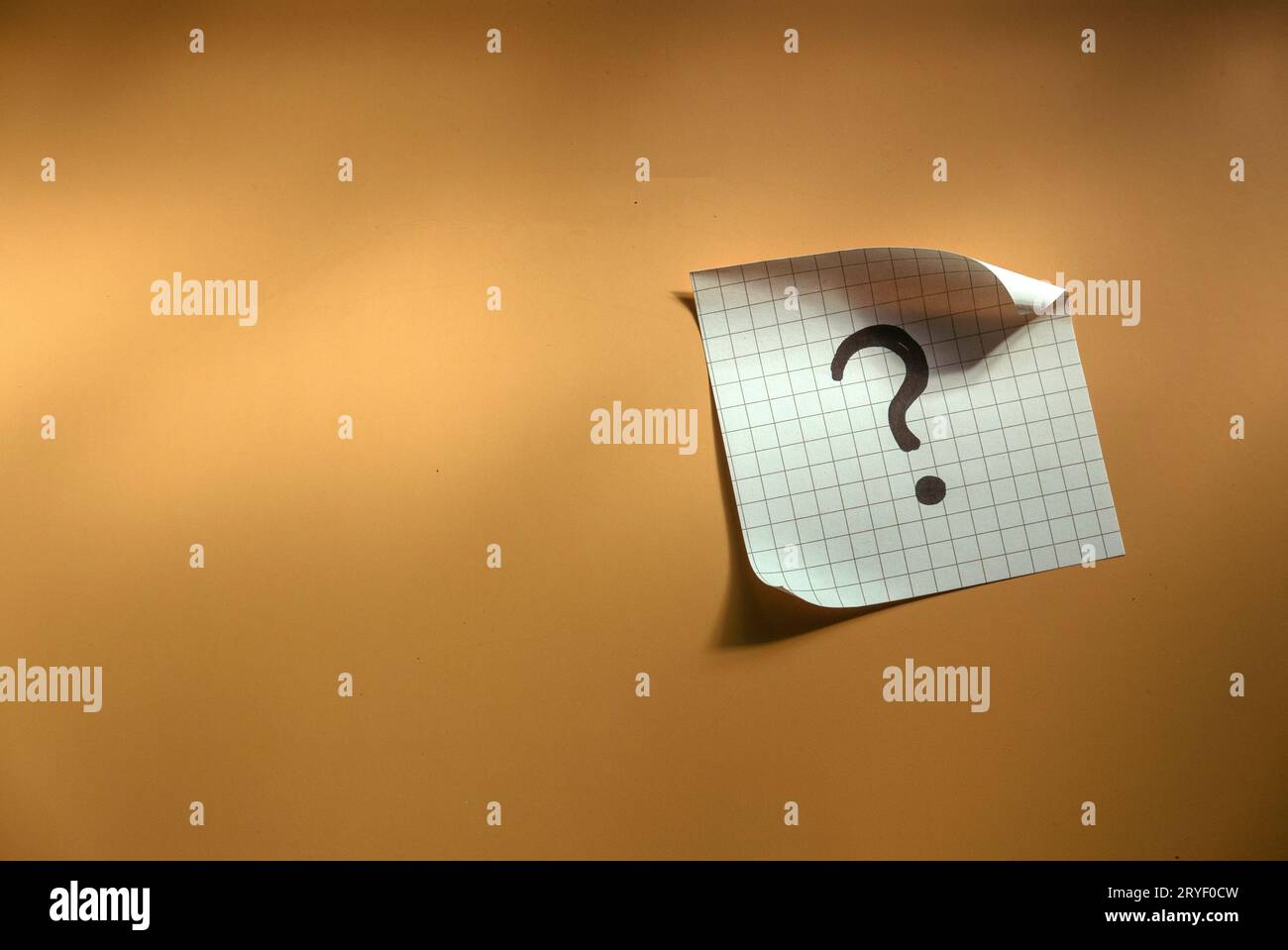 Questions and answer concept. Question mark written on paper. Brown ...