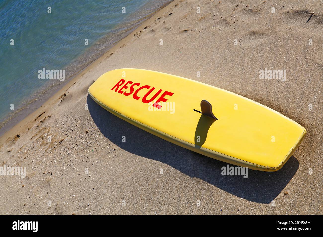 Close up yellow surfing board on sand sea beach Stock Photo - Alamy