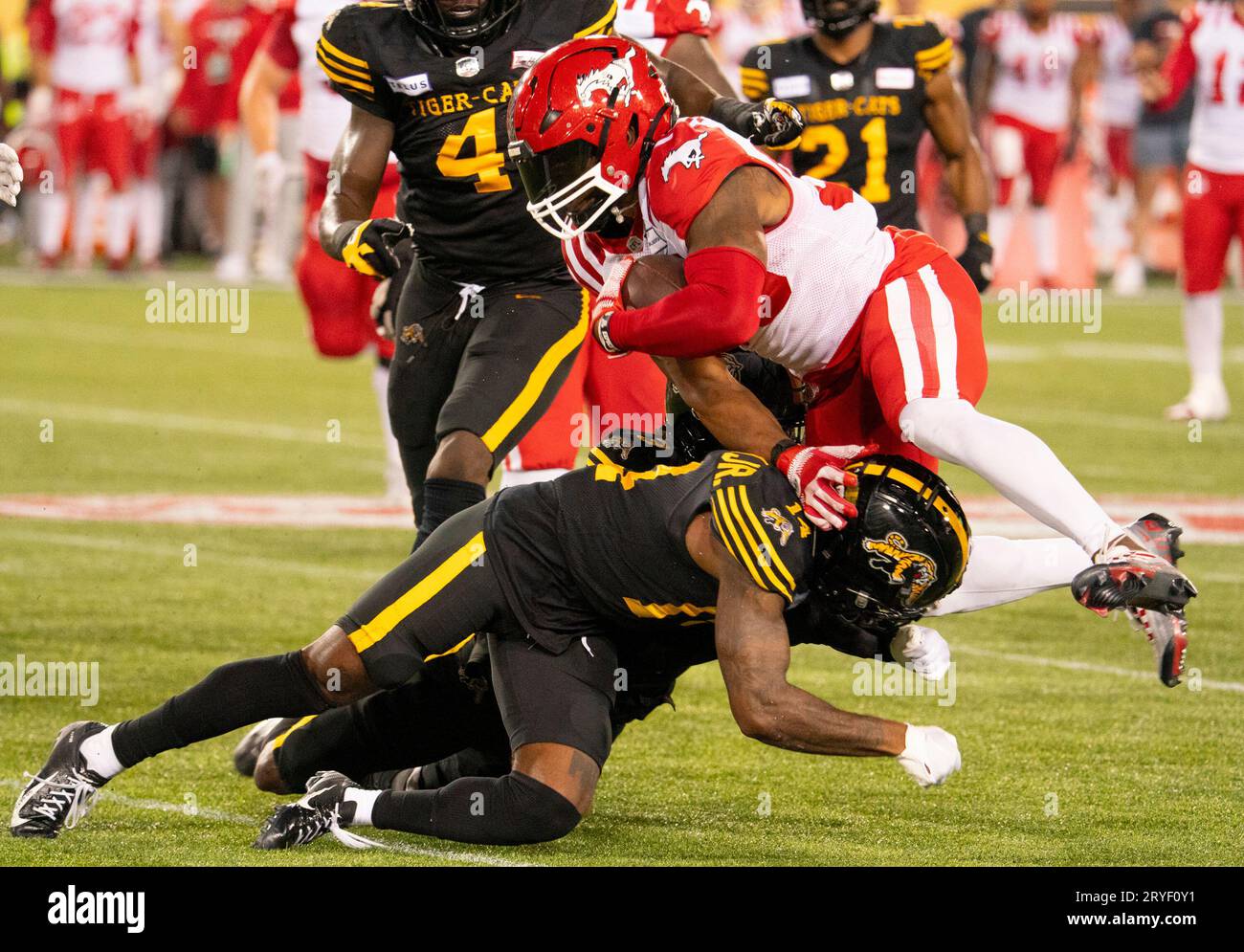 Calgary Stampeders running back Ka'Deem Carey (35) is tackled by ...