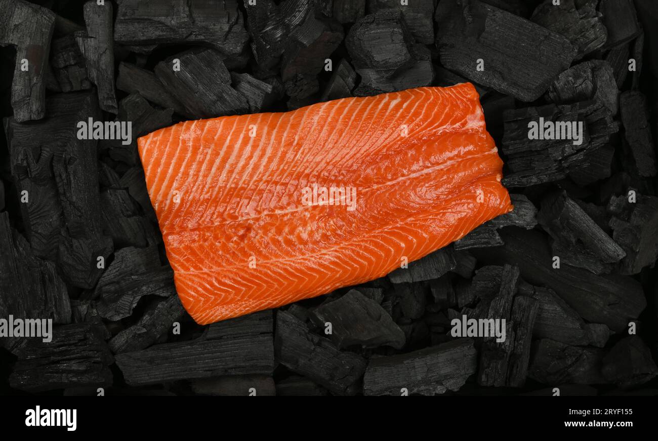 Cooking raw salmon fish fillet on charcoal Stock Photo - Alamy
