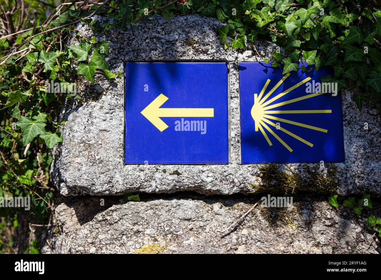 Camino de Santiago sign tiles on rock on outdoor. Way of St. James ...