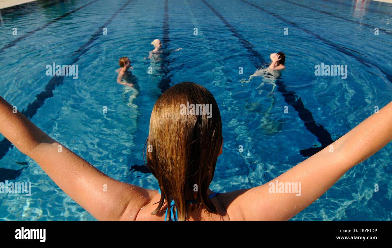 Woman diving into swimming pool hi-res stock photography and images - Alamy