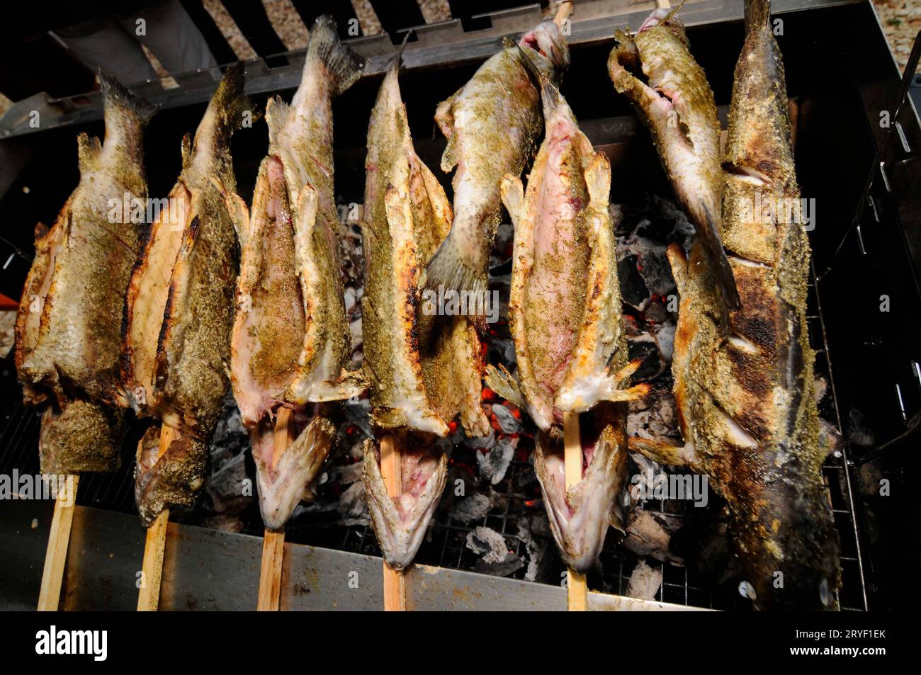 Fish on a stick, a grilled fish dish Stock Photo - Alamy