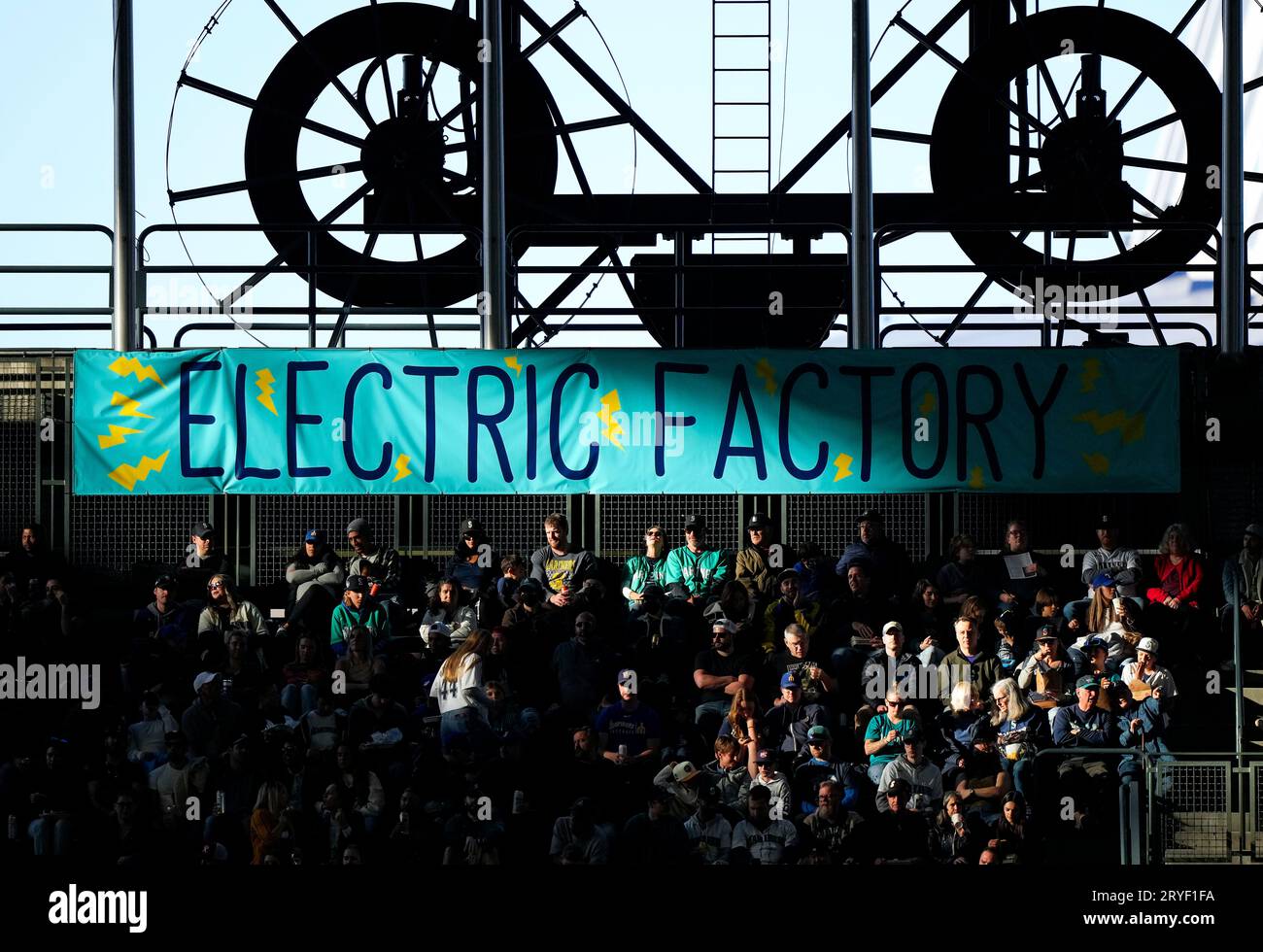 Fans sit under an "Electric Factory" sign in the outfield during the ...