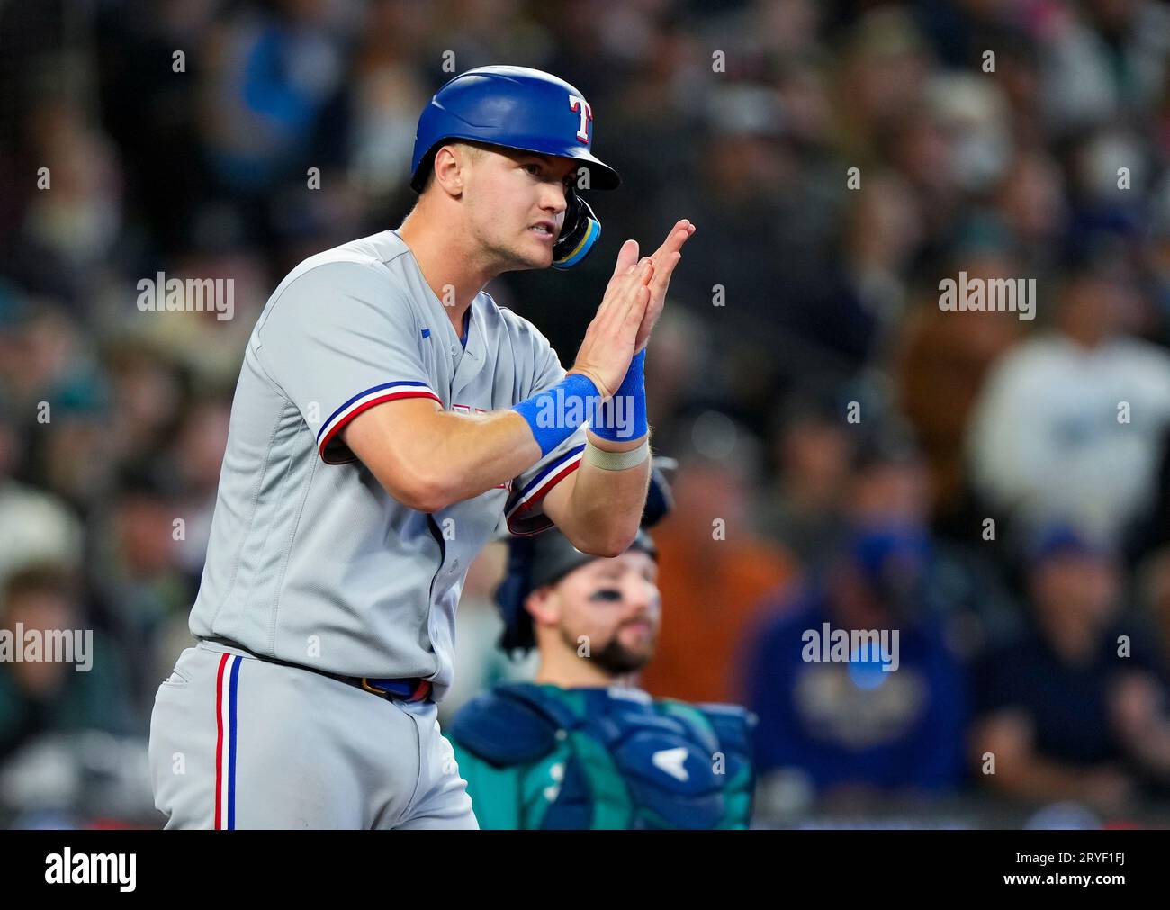 Texas Rangers' Josh Jung claps after scoring on an RBI single hit by ...
