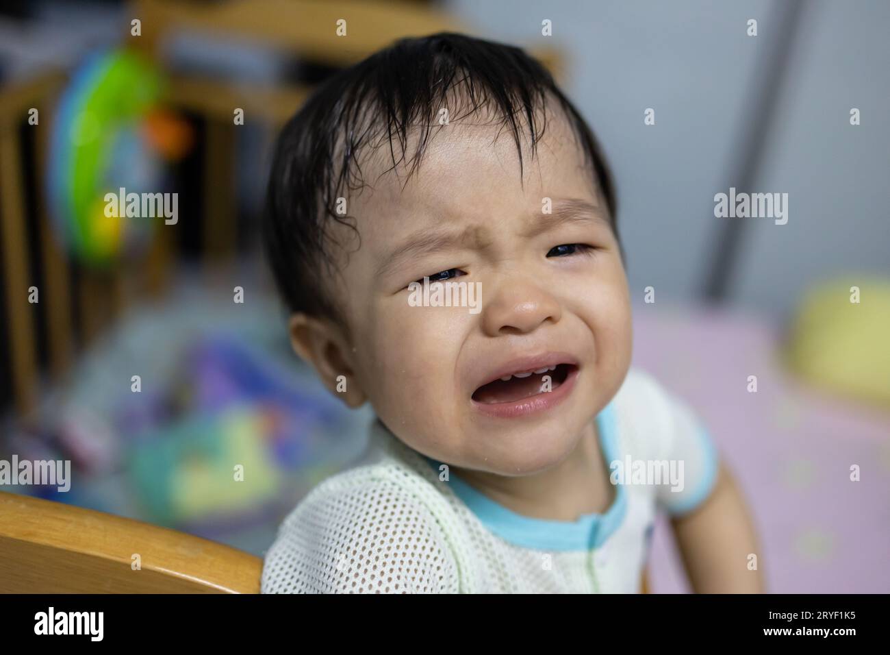 Portrait image of 1-2 years old childhood child with face of sad and ...