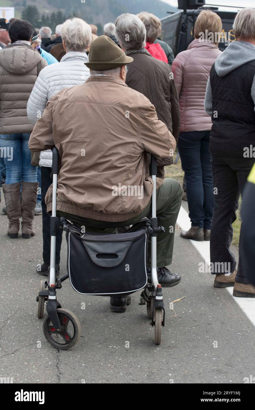 Rollator as walking aid for an old man Stock Photo - Alamy