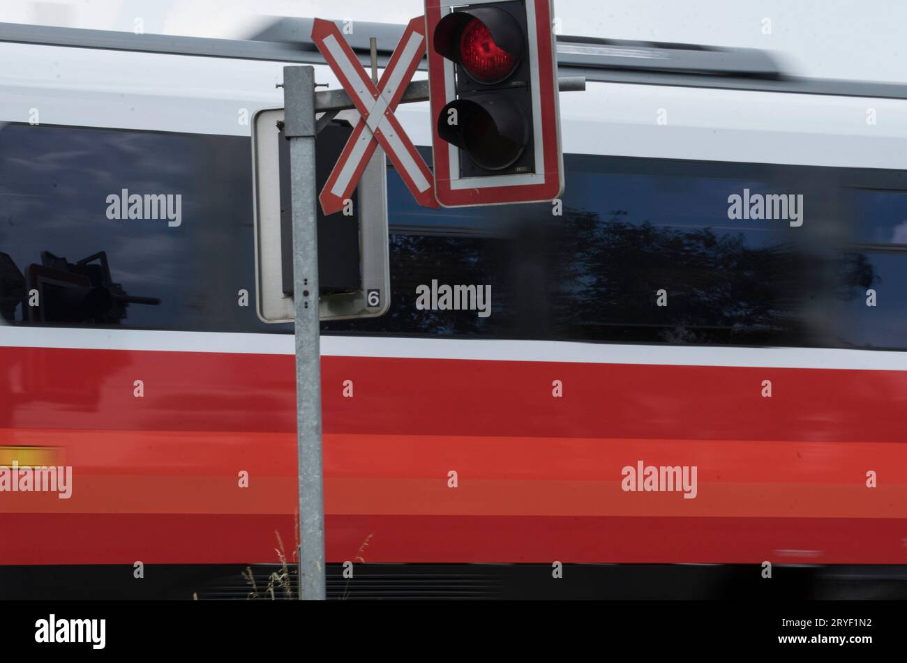 Ungated railroad crossing with level crossing sign Stock Photo - Alamy