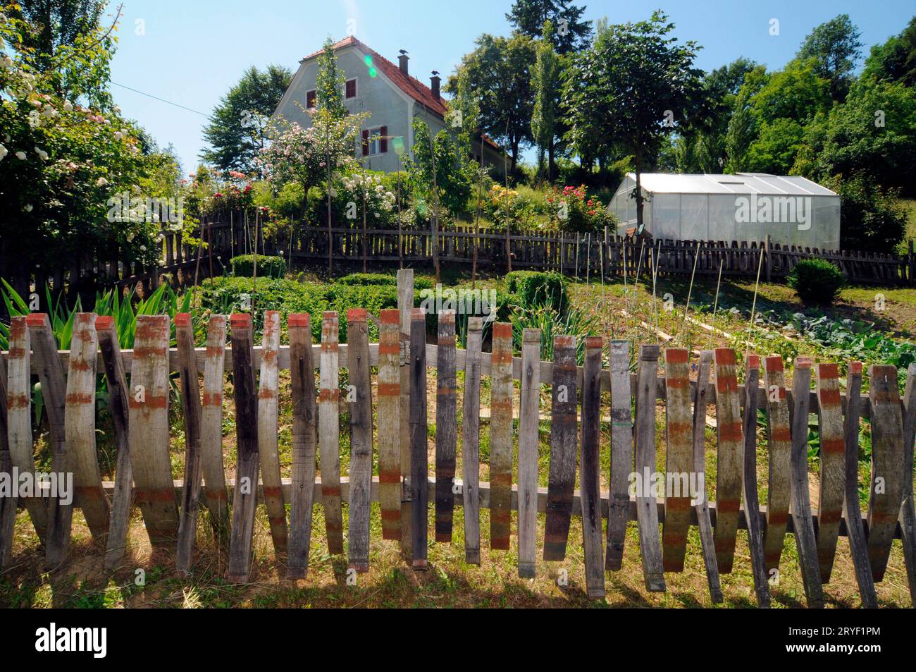 Wooden fence as demarcation to other land Stock Photo - Alamy