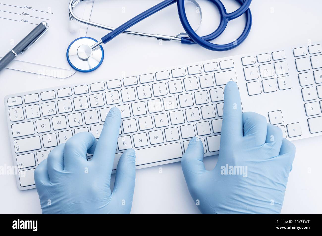 Doctor Hands in gloves typing on computer keyboard. Telemedicine or ...