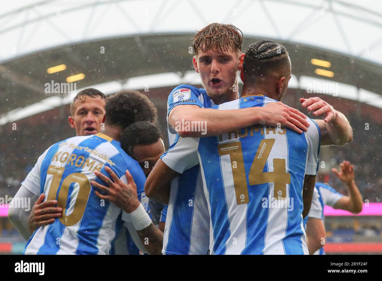 Jack Rudoni #8 of Huddersfield Town and Sorba Thomas #14 of ...