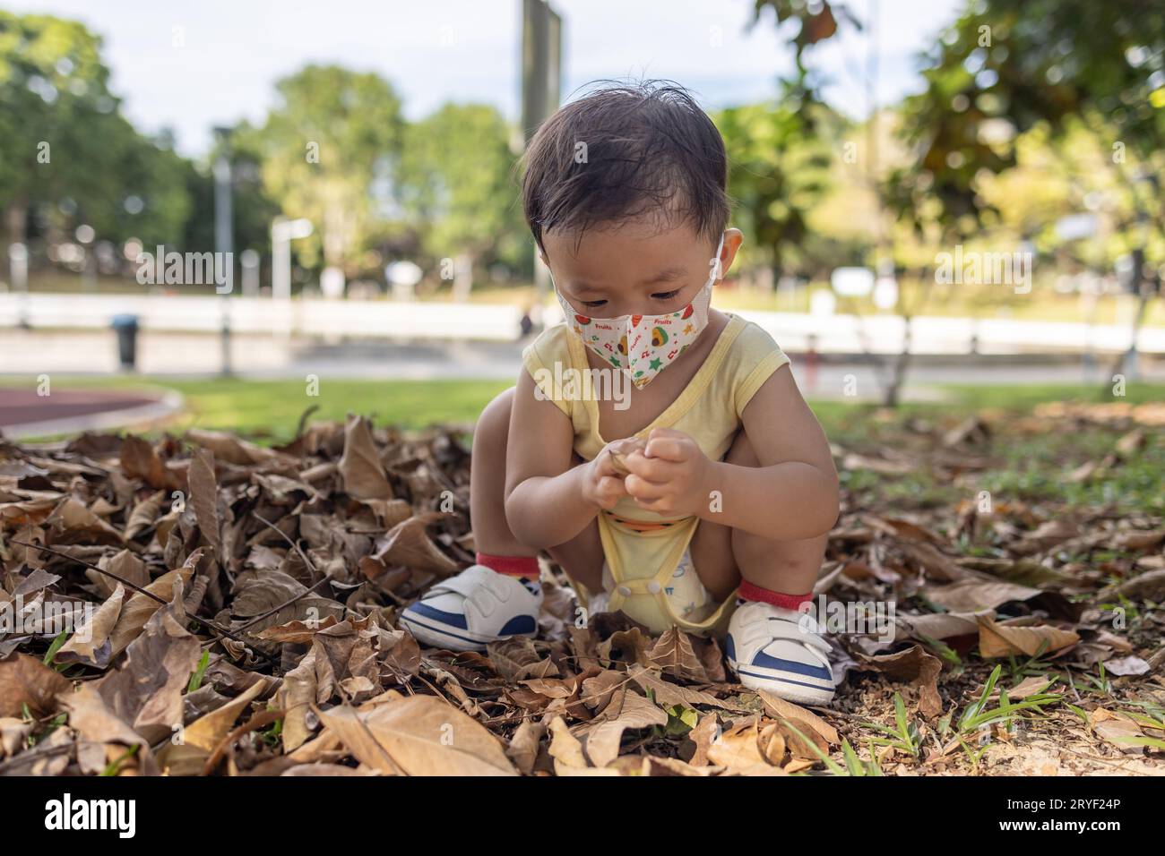 Portrait image of Happy 1-2 years old Asian Chinese child playing on ...