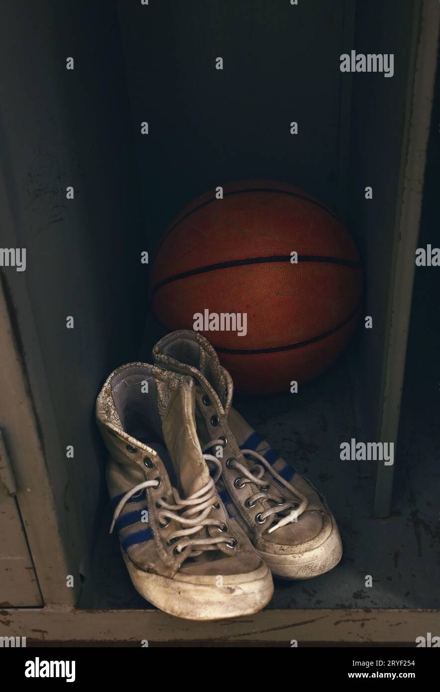 Old sport sneakers shoes and basketball ball Stock Photo - Alamy