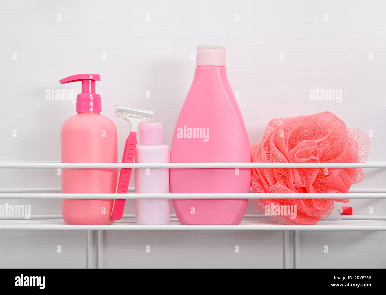 Pink bottles of hygiene toiletries in white bath Stock Photo - Alamy