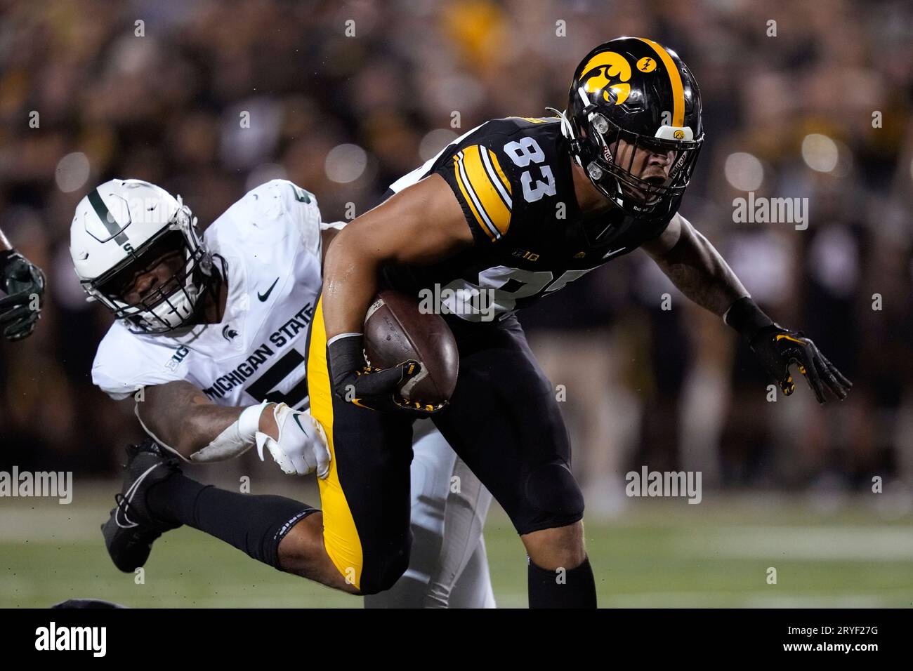 Iowa tight end Erick All (83) breaks a tackle by Michigan State ...